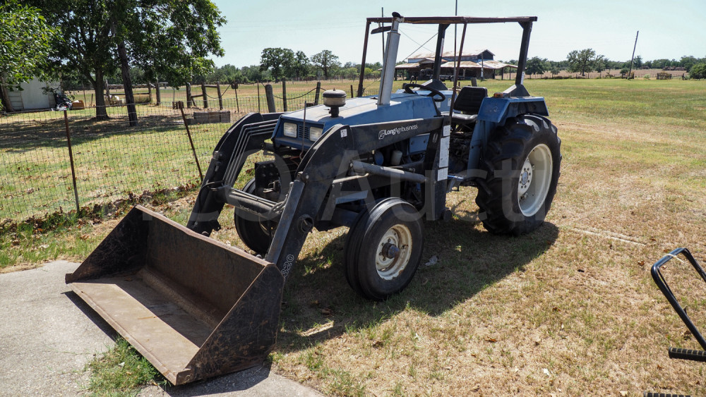 Long 520 Tractor with front loader - Swico Auctions