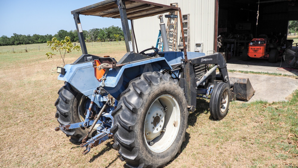 Long 520 Tractor with front loader - Swico Auctions
