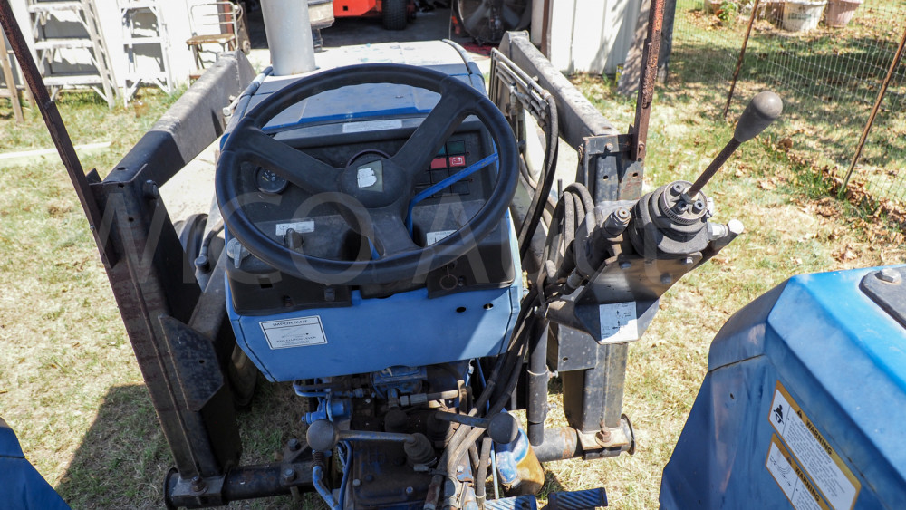 Long 520 Tractor with front loader - Swico Auctions