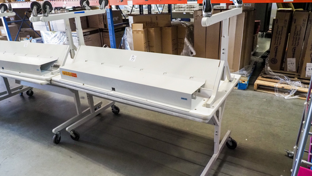 2 white 30x60” rolling tables - Swico Auctions